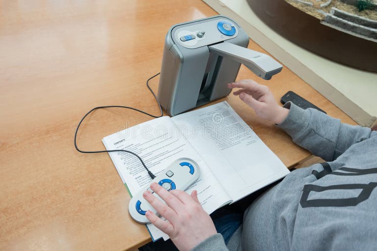 A Visually Impaired Man Uses a Scanning and Reading Machine. Stock ...