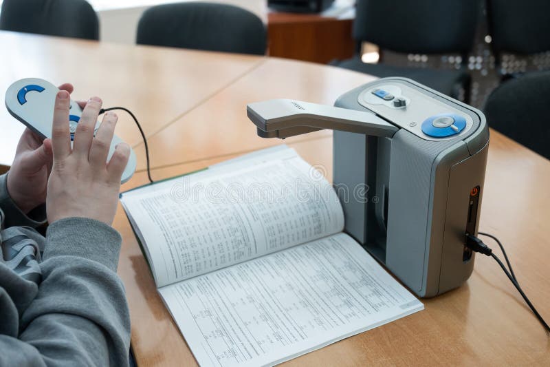 A Visually Impaired Man Uses a Scanning and Reading Machine. Stock ...