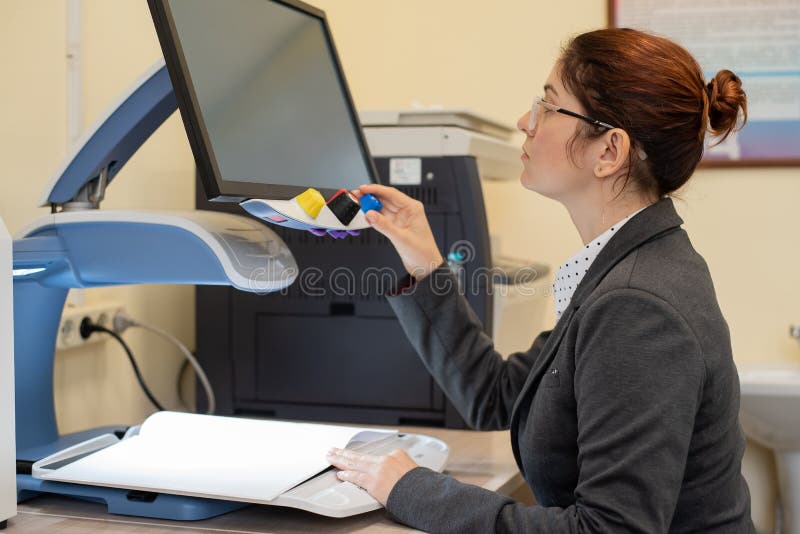 A Visually Impaired Man Uses a Scanning and Reading Machine. Stock ...