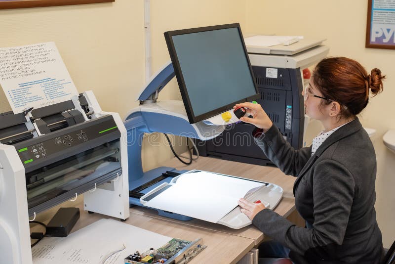 A Visually Impaired Man Uses a Scanning and Reading Machine. Stock ...