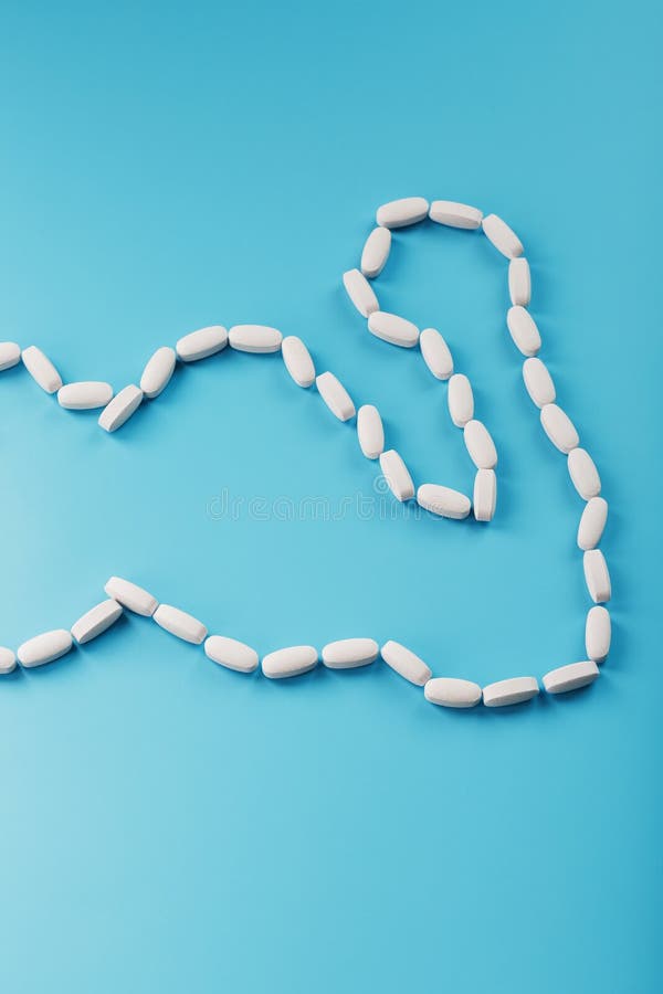 Vitamins in the Form of Biceps Muscles on a Blue Background Stock Image ...