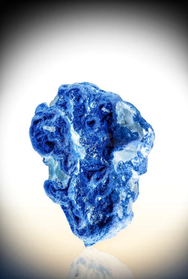 A Vivid Blue Mineral with a Richly Textured Surface, Set Against a Soft ...