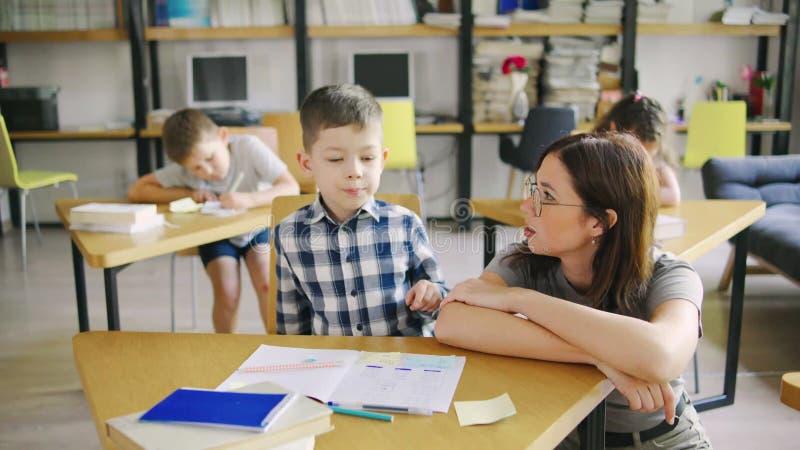 A Vivid Classroom Setting Featuring a Teacher and Engaged Students in a ...