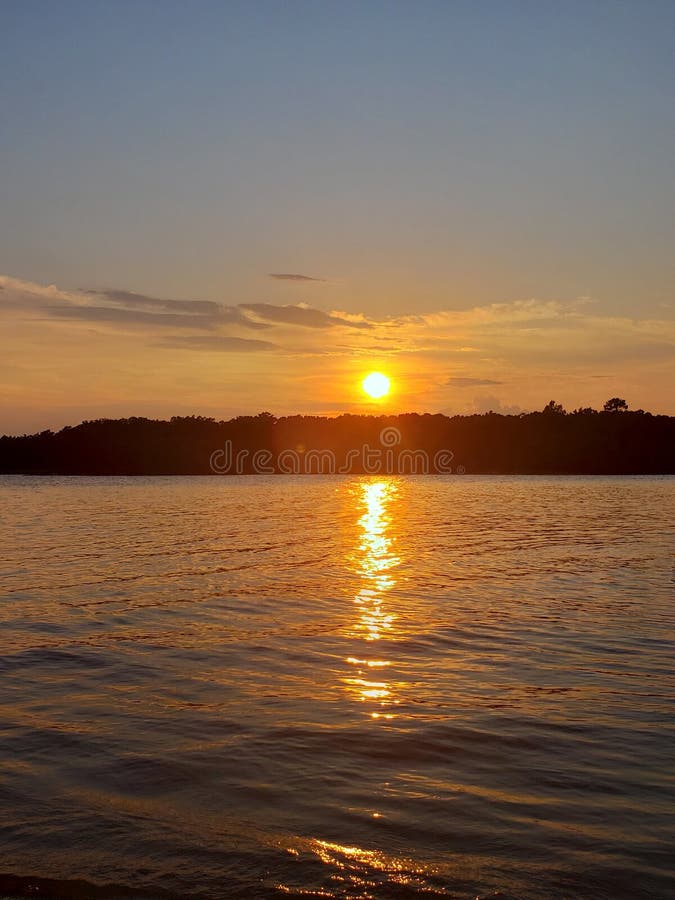 Vivid colorful sunsetting stock image. Image of beach - 241443613