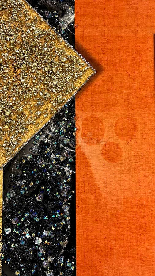 Vivid Contrast of Gold and Black Sequins Against a Plain Orange ...