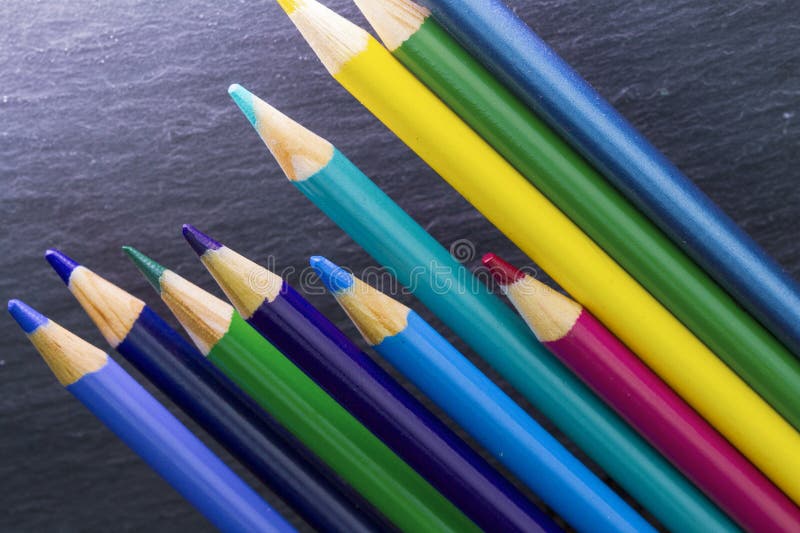 Vivid Rainbow of Colored Pencils on Textured Slate Surface Stock Photo ...