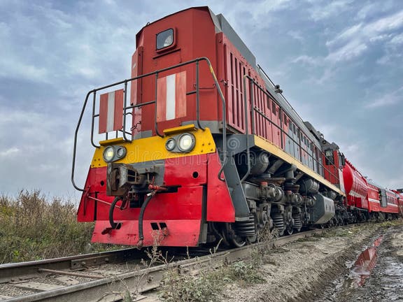 Vivid Red Fire Train on Tracks with a Beautifully Dramatic Sky in ...