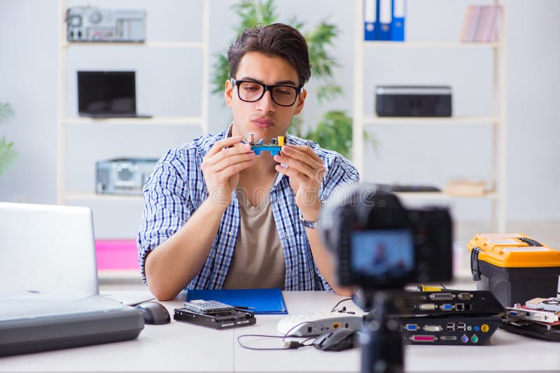 The Vlogger Recording Computer Repair on Camera for Vlog Blog Stock ...