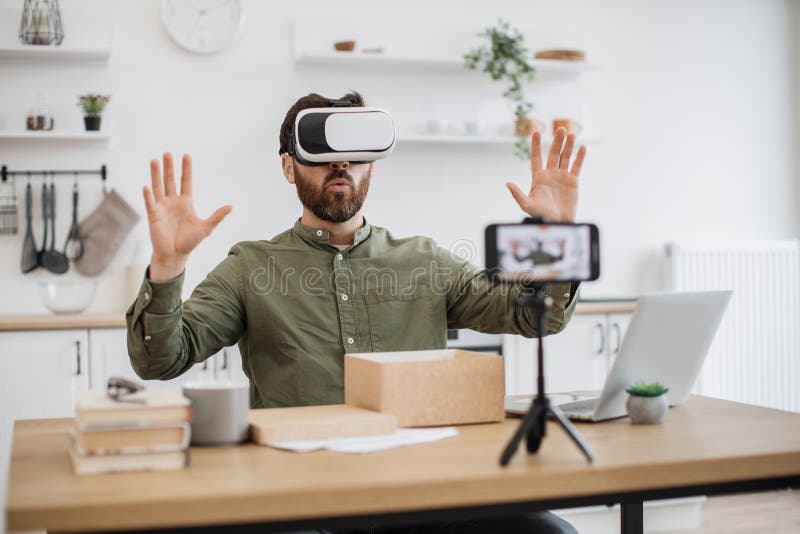 Vlogger in VR Headset Doing Live Streaming Using Smartphone Stock Image ...