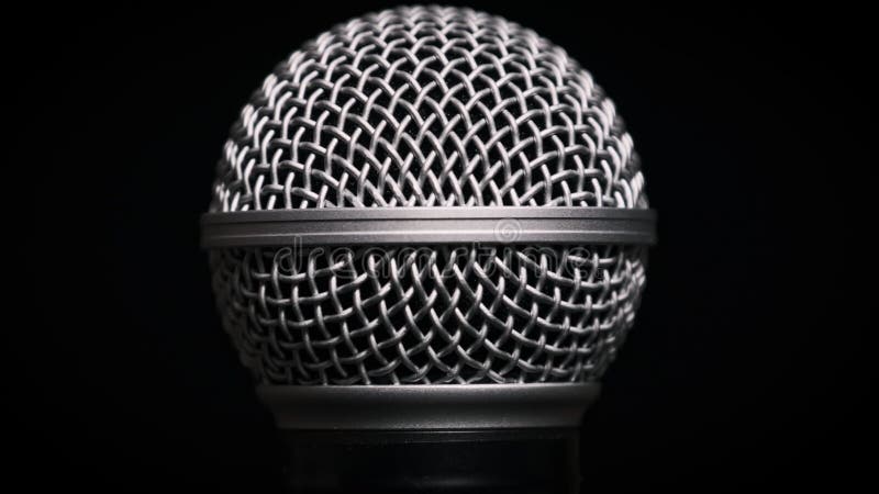 The Vocal Microphone Slowly Rotates on a Black Background Stock Footage ...