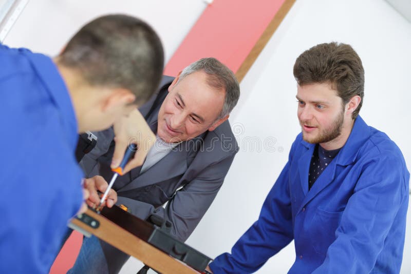 Vocational Teacher with Students Stock Image - Image of woodwork ...