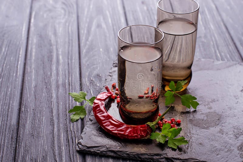 Vodka and chilli pepper stock image. Image of transparent - 68624525