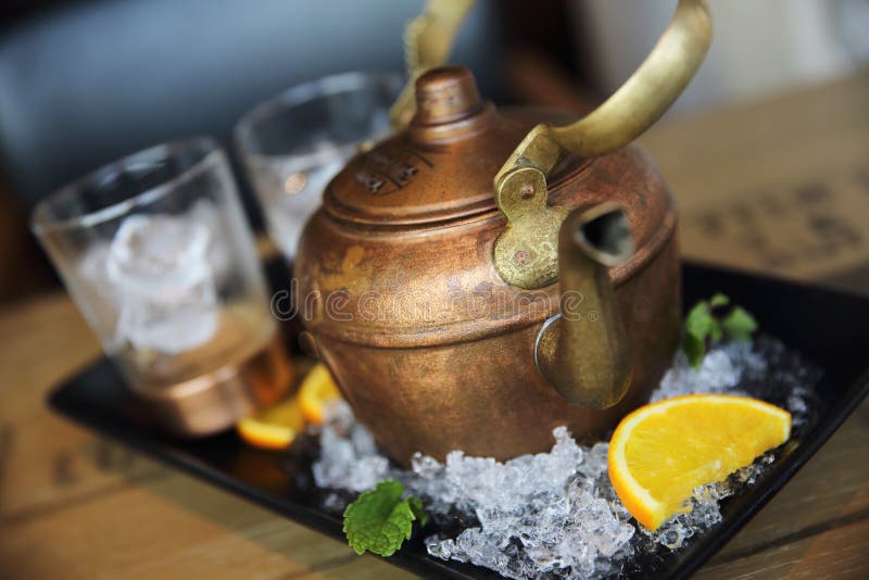Vodka cocktail in tea pot stock photo. Image of isolated - 136994380