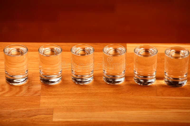 Vodka glass shot table stock photo. Image of line, glass - 137621556