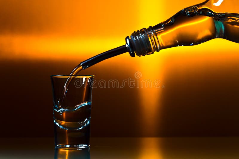 Vodka on glass table stock photo. Image of liquor, neat - 48310176