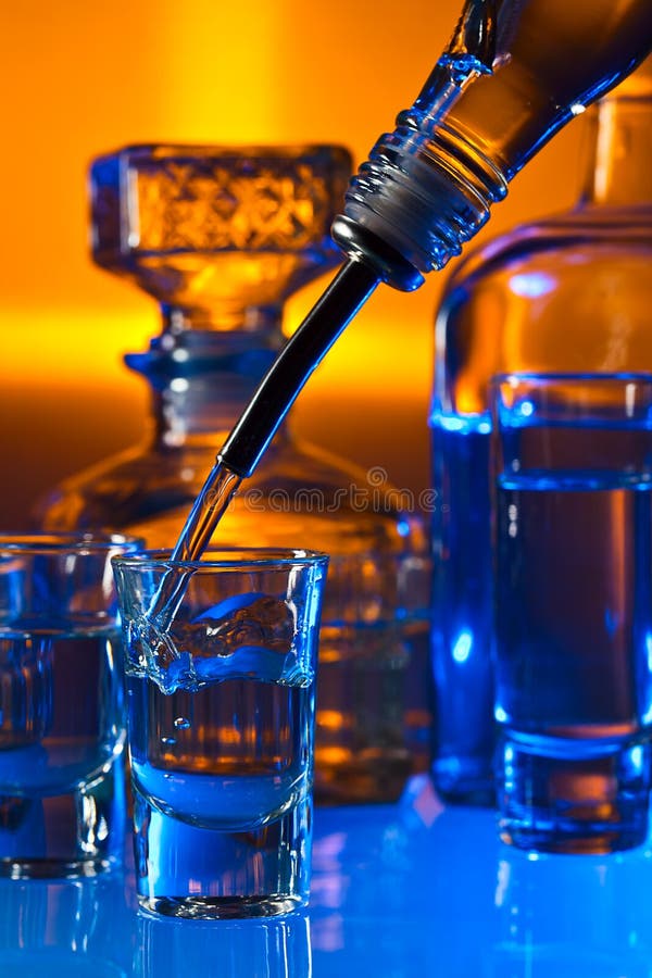 Vodka on glass table stock photo. Image of liquor, neat - 48310176