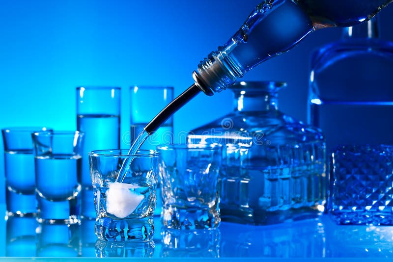 Vodka on glass table stock photo. Image of liquor, neat - 48310176