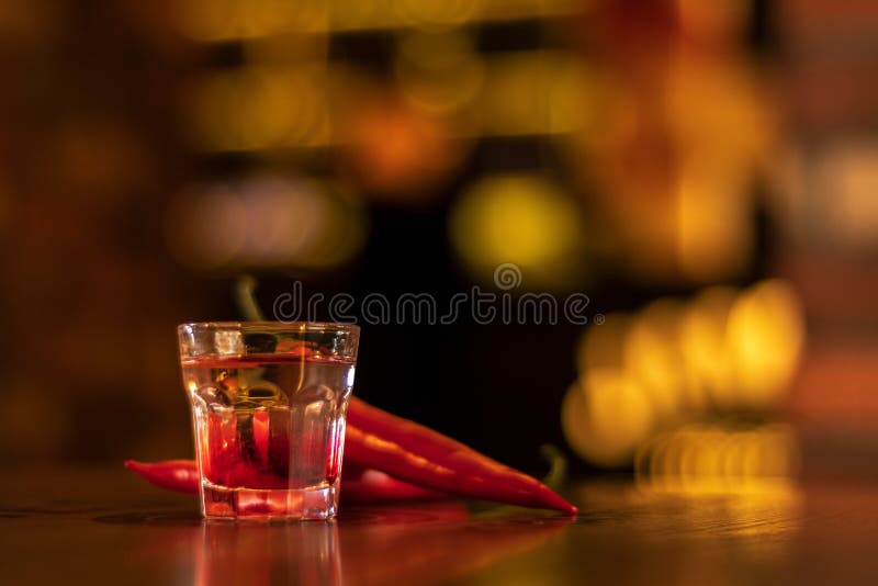 Vodka Shot with Chilli Pepper on Wooden Table Stock Photo - Image of ...