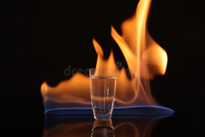 Vodka in Shot Glass and Flame on Black Background Stock Photo - Image ...
