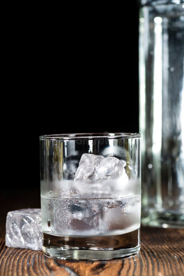 Vodka in a shot glass stock photo. Image of colorless - 26735758