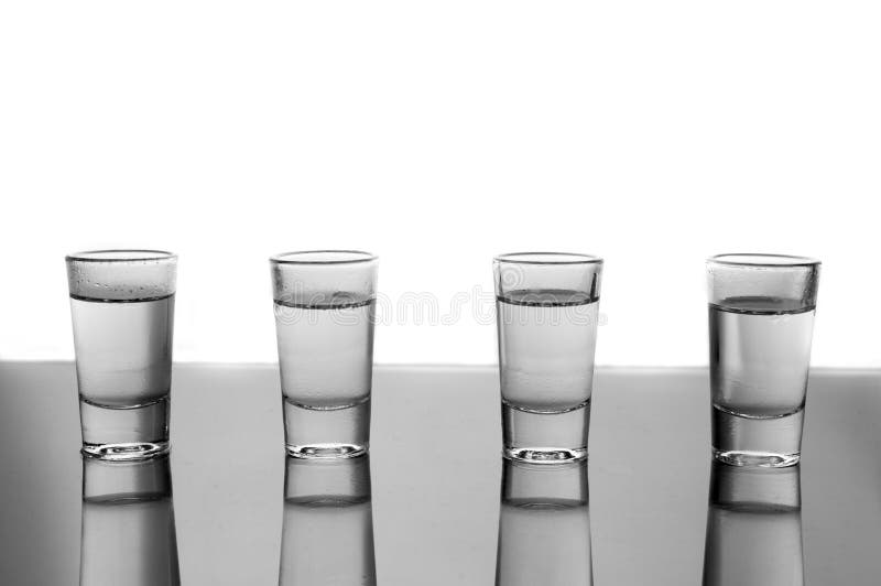 Vodka Shots Filled with Alcohol on Glass Bar Table Stock Photo - Image ...