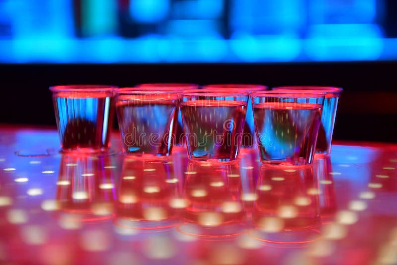 Vodka or Tequila Shots on Bar Counter in Night Club. Stock Image ...