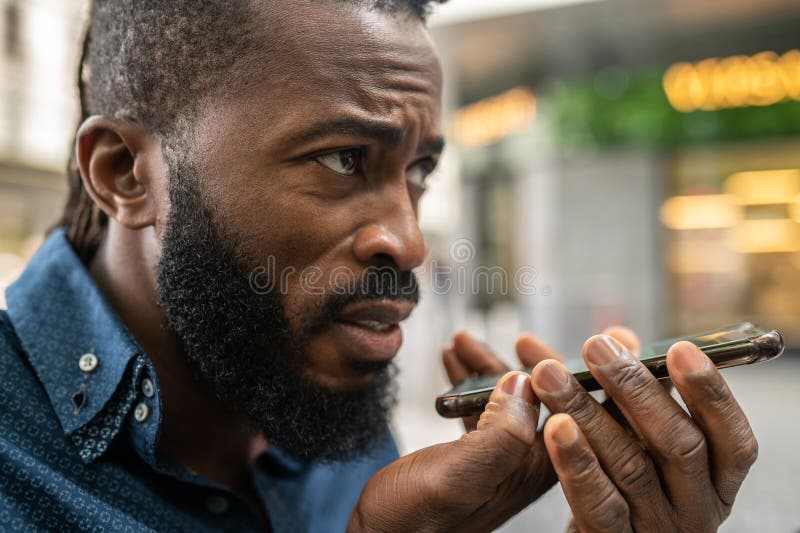 Close Up of a Dark-skinned Man Recording a Voice Message Stock Image ...