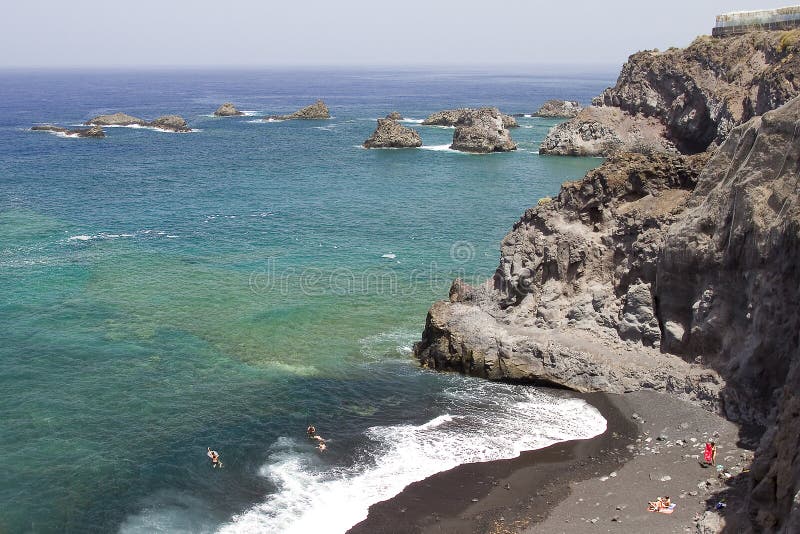 Volcanic beach stock image. Image of sunbathing, lava - 30763603