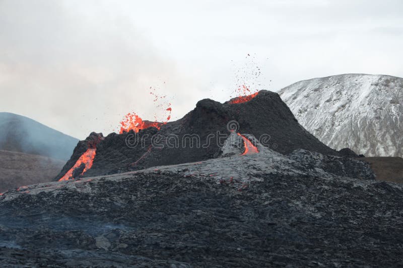 Volcanic Eruption with Glowing Orange Lava Flow Surrounded by a Pool of ...