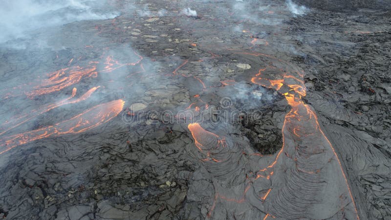 Volcanic Eruption with Glowing Orange Lava Flow Surrounded by a Pool of ...