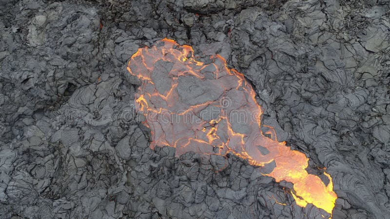 Volcanic Eruption with Glowing Orange Lava Flow Surrounded by a Pool of ...