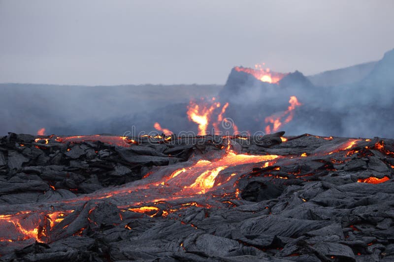 Volcanic Eruption with Glowing Orange Lava Flow Surrounded by a Pool of ...