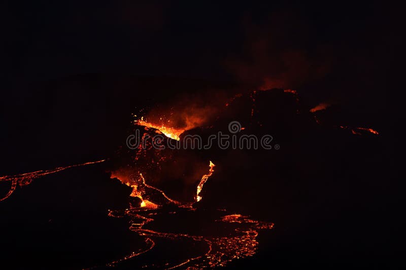Volcanic Eruption with Glowing Orange Lava Flow Surrounded by a Pool of ...