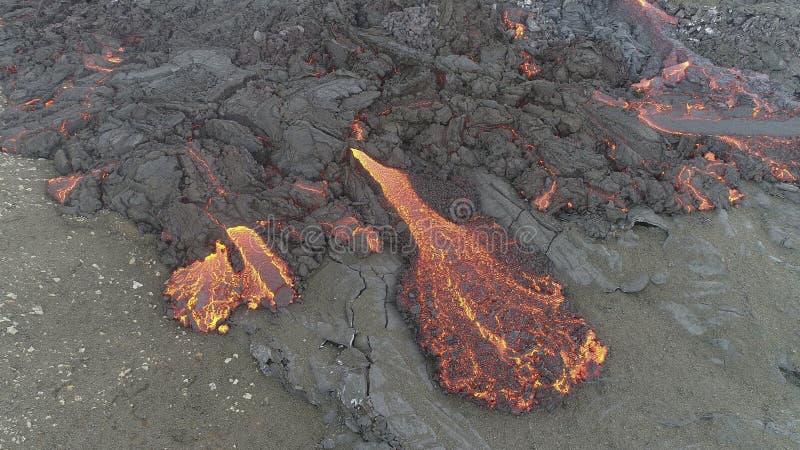 Volcanic Eruption with Glowing Orange Lava Flow Surrounded by a Pool of ...