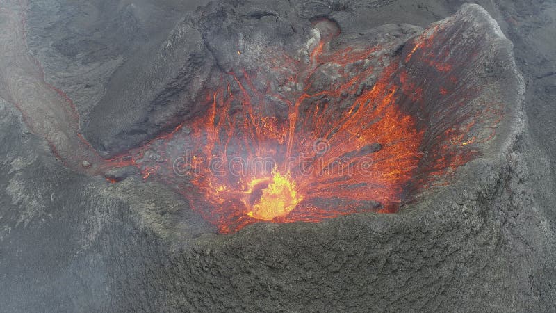 Volcanic Eruption with Glowing Orange Lava Flow Surrounded by a Pool of ...