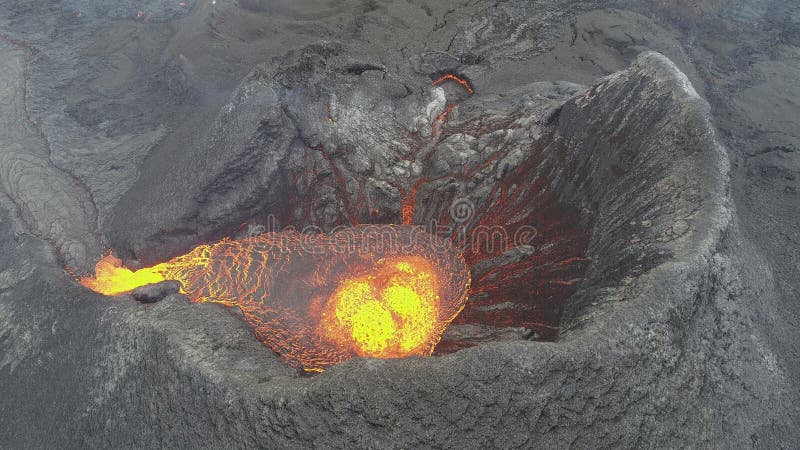 Volcanic Eruption with Glowing Orange Lava Flow Surrounded by a Pool of ...