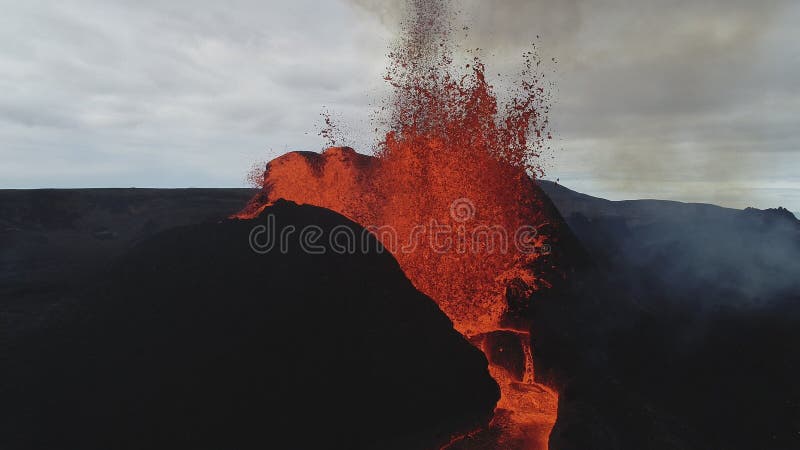 Volcanic Eruption with Glowing Orange Lava Flow Surrounded by a Pool of ...