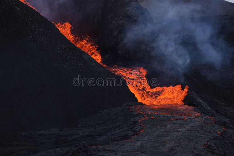 Volcanic Eruption with Glowing Orange Lava Flow Surrounded by a Pool of ...