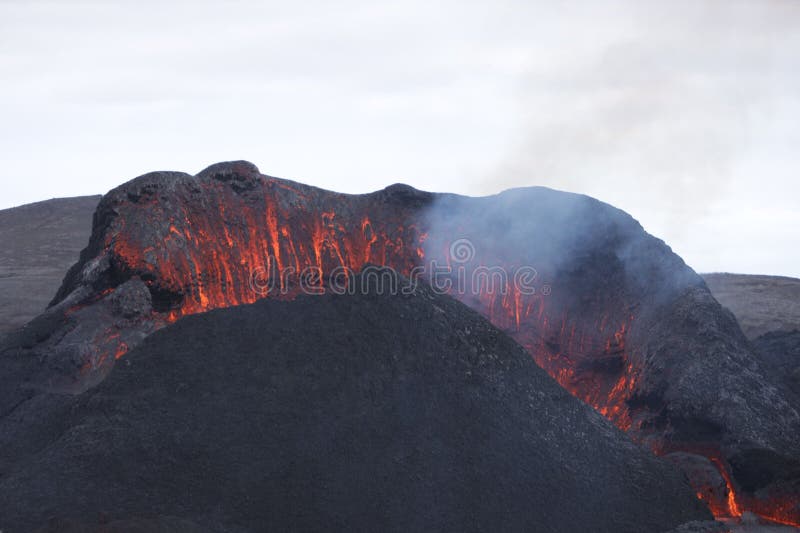 Volcanic Eruption with Glowing Orange Lava Flow Surrounded by a Pool of ...