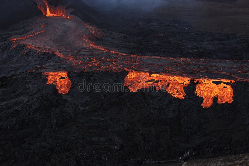 Volcanic Eruption with Glowing Orange Lava Flow Surrounded by a Pool of ...