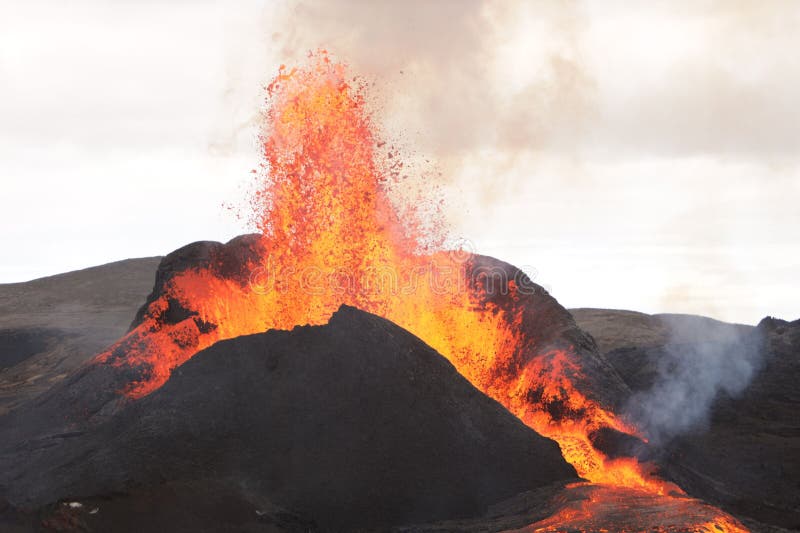 Volcanic Eruption with Glowing Orange Lava Flow Surrounded by a Pool of ...