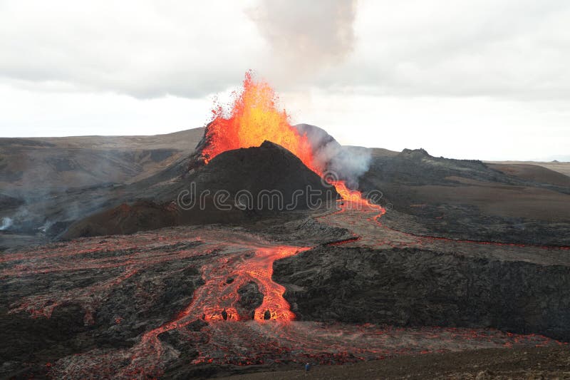 Volcanic Eruption with Glowing Orange Lava Flow Surrounded by a Pool of ...