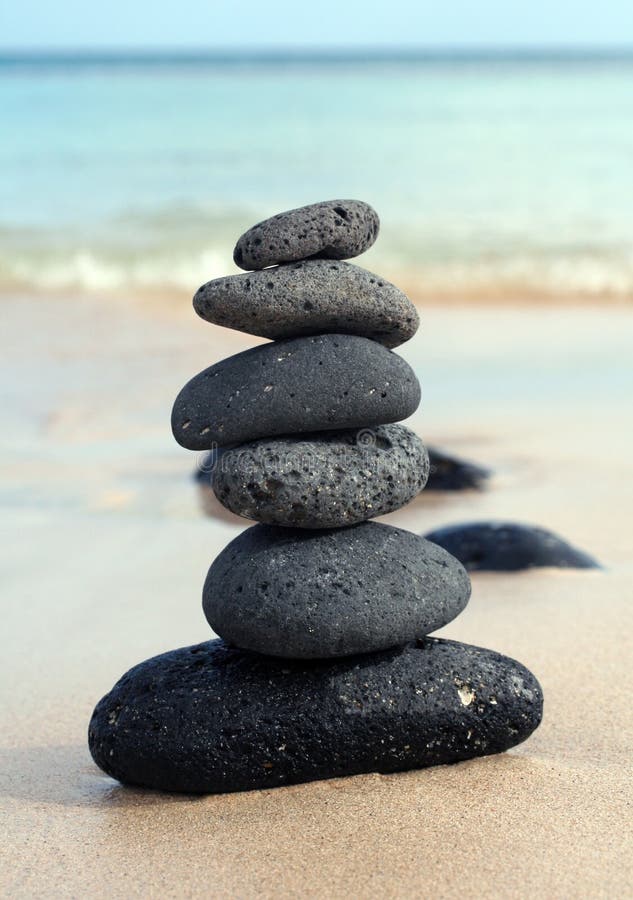 Stacked pebbles on beach stock image. Image of damp, outdoor - 3429309