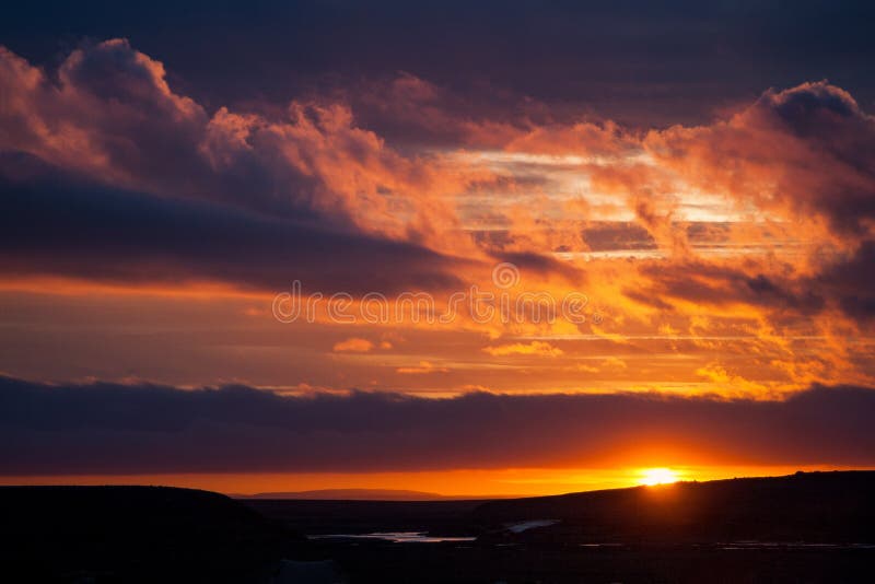 Volcanic Plateau with a Setting Sun Against a Blazing Sunset Stock ...