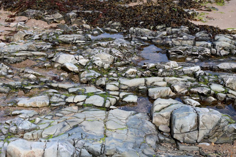 Volcanic Rock Formations with Rock Pools at a Coastal Location Stock ...