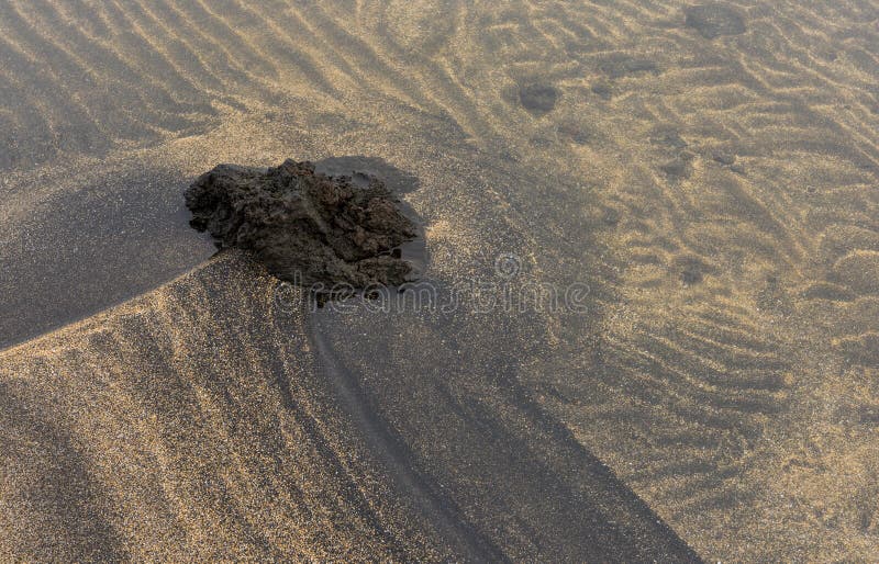 Volcanic Rock and Sand Patterns with Water Stock Image - Image of ...