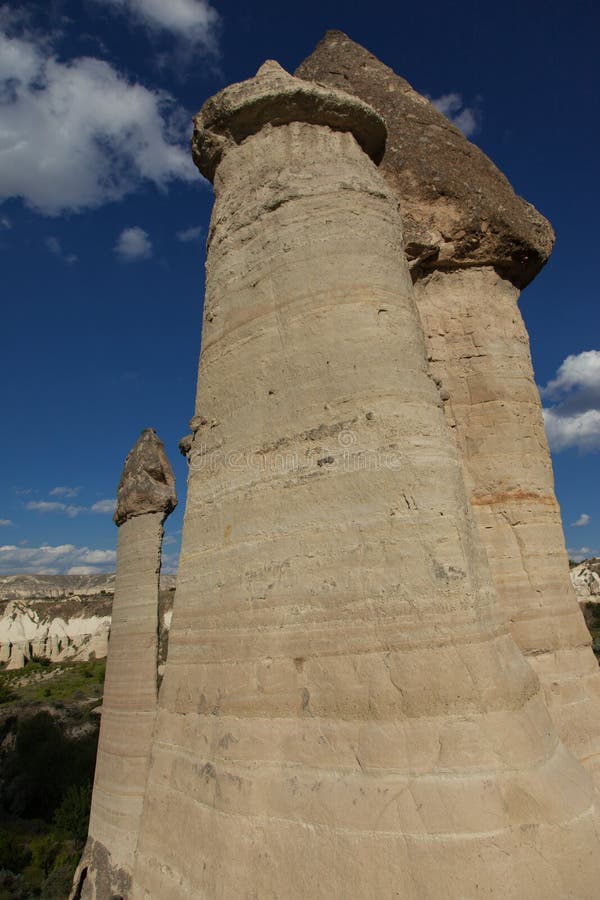 Volcanic Tall Rock Formations in Front of Sky in Cappadocia Stock Photo ...