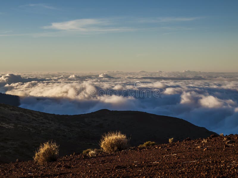 Volcano (above the clouds) stock photo. Image of dark - 49507258