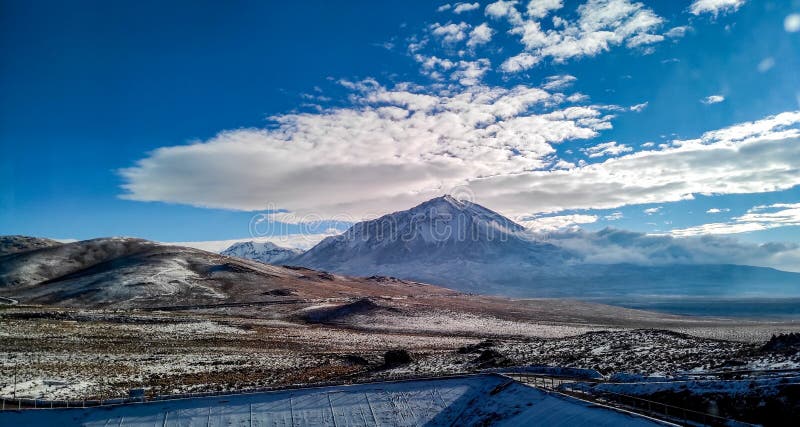 Volcano Covered with Snow and Blue Sky Stock Photo - Image of butterfly ...