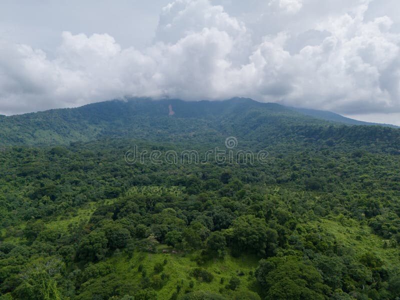 Volcano Green Valley with White Clouds Stock Image - Image of ...